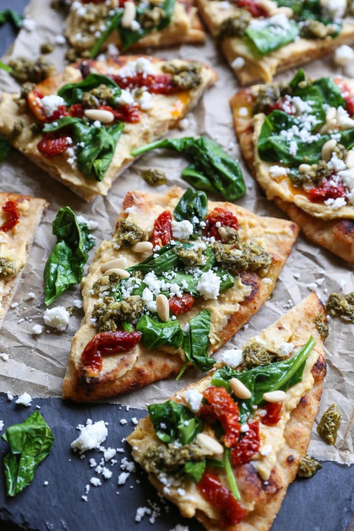 Hummus Flatbread with Sun-Dried Tomatoes & Pesto - The Roasted Root