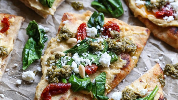 Hummus Flatbread with Sun-Dried Tomatoes & Pesto - The Roasted Root